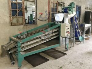 Machine à calibrer de noix de cajou